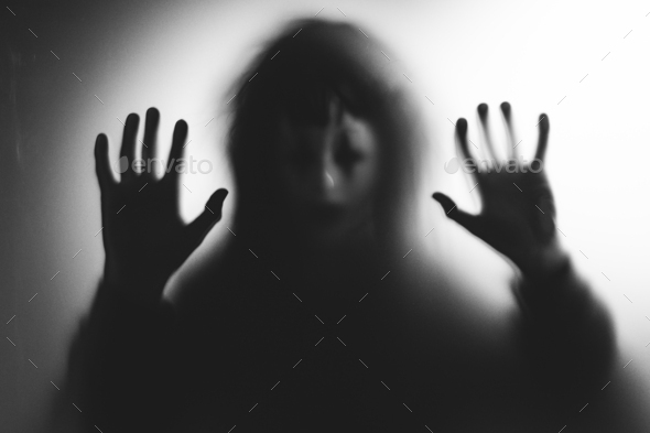 Shadowy figure behind glass - horror background Stock Photo by erika8213