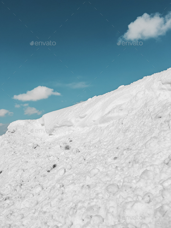 Winter season background, snow on the hill and blue sky with white ...