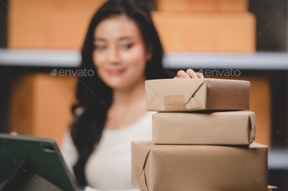 online shopping concept, happy young Asian business owner woman prepare ...