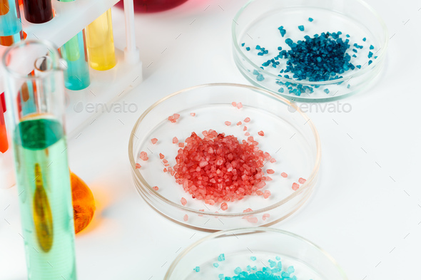 Colored liquids inside lab glassware on white table in laboratory Stock ...