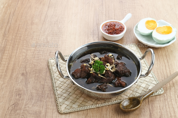 Rawon, Indonesian Traditional beef black soup. Stock Photo by tyasindayanti