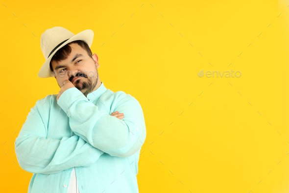 Concept of people, young fat man on yellow background Stock Photo by ...