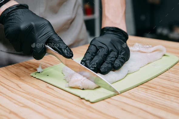 Cooking fish in a cooking mater class. The butchering of the fish. home ...
