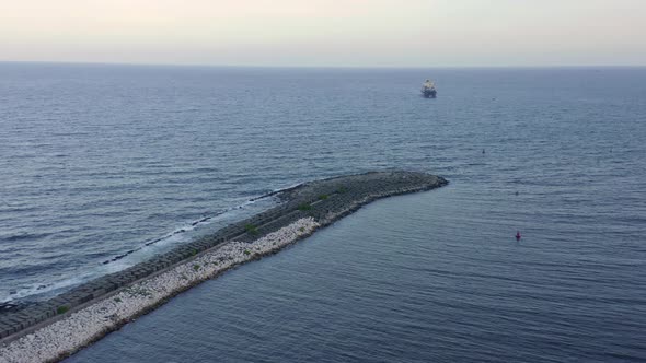 Breakwater pier at Haina port and ship in background, Dominican ...