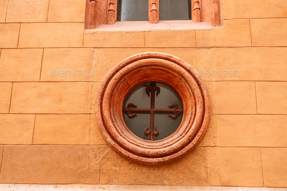 Old antique round window in an dirty wall of the monastery Stock Photo ...