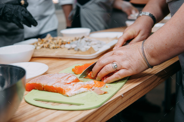 Cooking red fish in a cooking mater class. The butchering of the fish ...