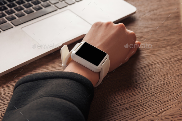 Cropped view of woman wearing white smartwatch with blank screen Stock ...