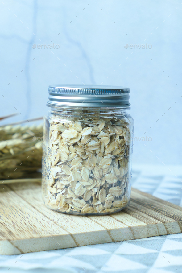 roasted oats flakes in a jar on table Stock Photo by towfiqu98 | PhotoDune