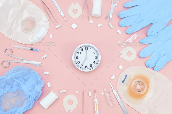 Surgeon's kit for surgery with a watch and a colostomy bag on a soft ...