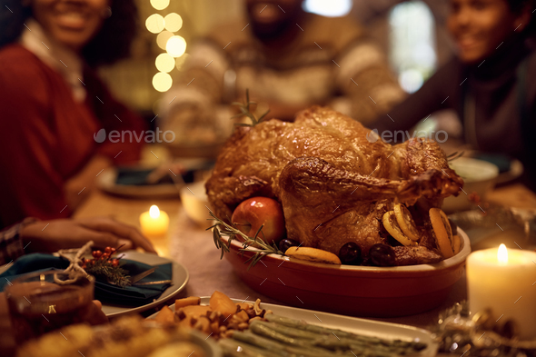Roast turkey on dinning table during family meal on Thanksgiving. Stock ...