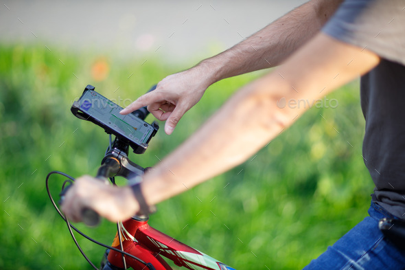 Man planning route using GPS navigation application in mobile phone on ...