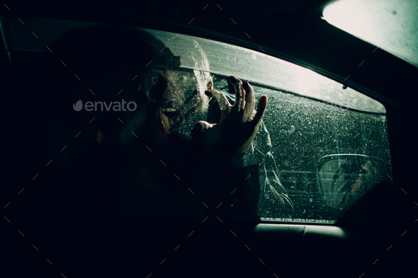 Zombie male makeup for halloween concept. Blood on skin face Stock ...