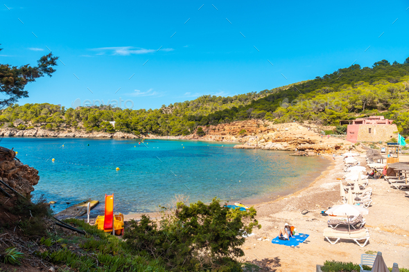 Tourists on the paradisiacal beaches on the coast of Ibiza, Playa ...