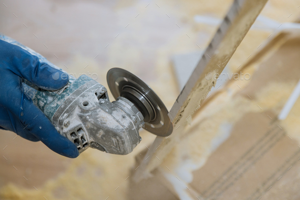 Tiling tile trimming cutting repair of the floor gres tiles. Stock ...