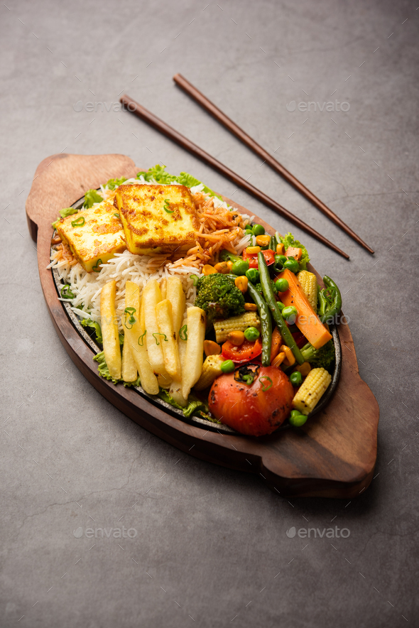 Paneer Sizzler is an Indian version with cottage cheese, salad served ...