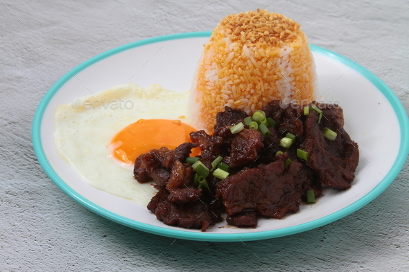 Freshly cooked Filipino food called Tapsilog Stock Photo by junpinzon