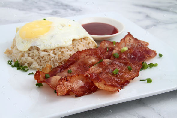 Freshly cooked Filipino food called Bacsilog Stock Photo by junpinzon