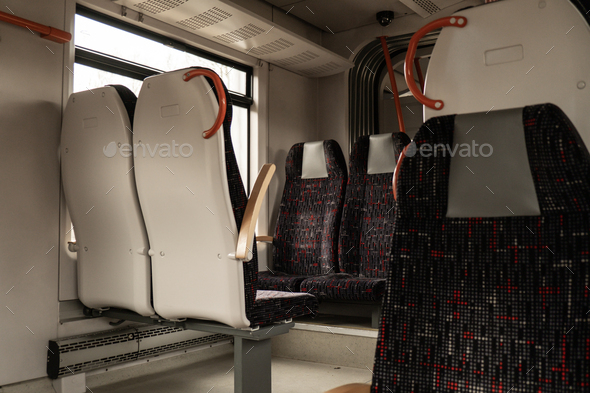 Interior view at trains empty seats window View on railroad track from ...