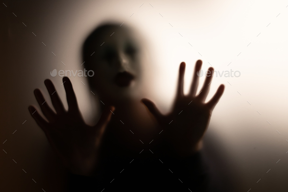 Shadowy figure behind glass - horror background Stock Photo by erika8213