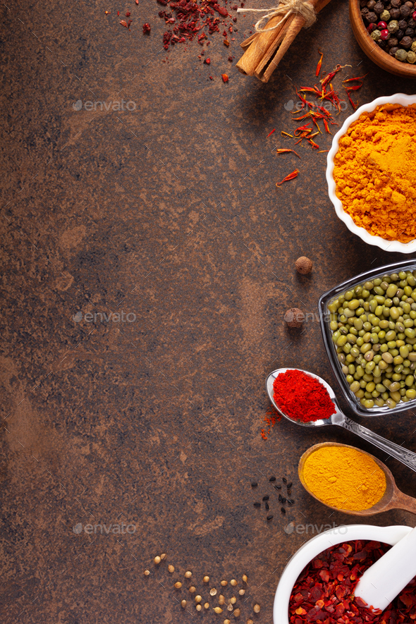 Variety of spices and herbs at table background. Cooking concept and ...
