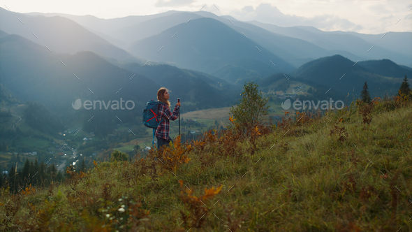Active millennial travel mountains nature. Young woman trekking on ...