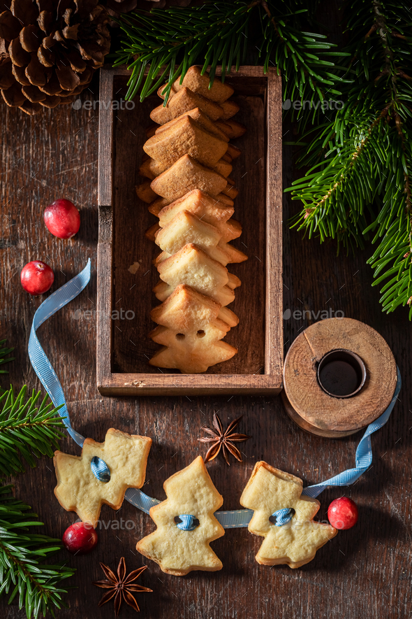 Handmade butter cookies chain as unique decorations. Stock Photo by Shaiith