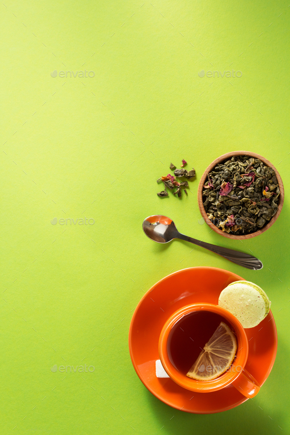 cup of tea at light green paper Stock Photo by seregam | PhotoDune