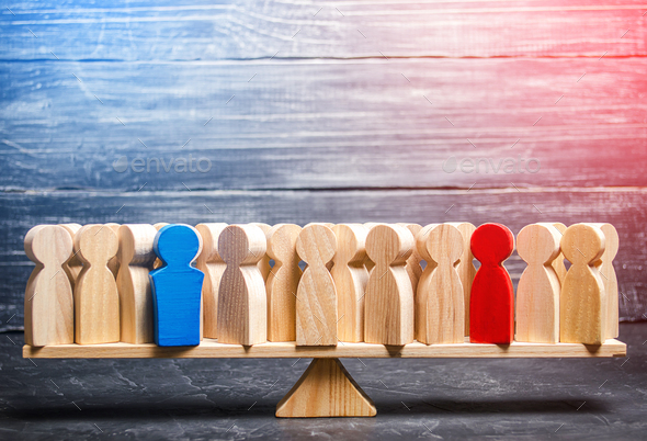 People on scales are divided into two opposing groups. Stock Photo by ...