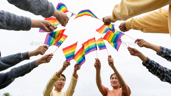 LGBTQ Rainbow Flags being waved symbol of Diversity Gay and lesbian for ...