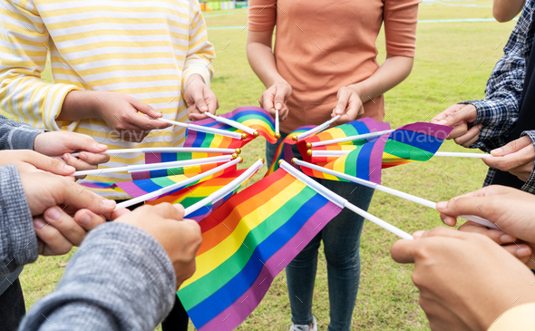 LGBTQ Rainbow Flags being waved symbol of Diversity Gay and lesbian for ...