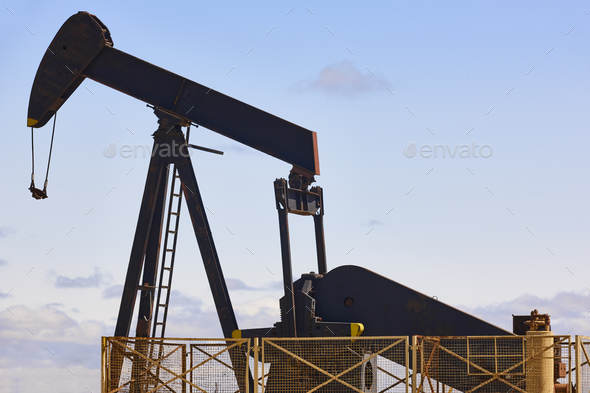 Oil pumping machine. Pump jack. Petroleum extraction. Global warming ...
