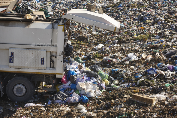 Truck unloading garbage on an open air dump. Waste treatment Stock ...