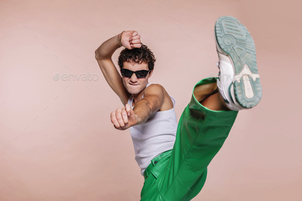 Young boy kick in the air Stock Photo by carlesmiro | PhotoDune