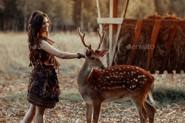 beautiful young Indian woman and deer Stock Photo by kaplickaya | PhotoDune