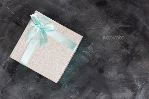 Blue gift box top view. Dark grey design background Stock Photo by ...