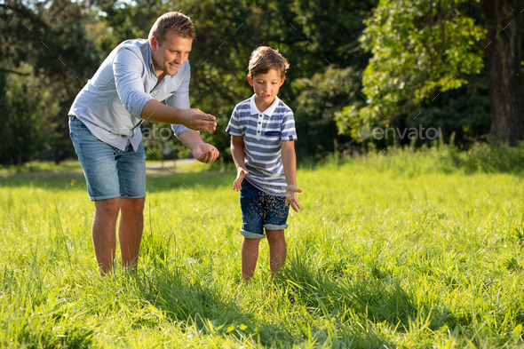 Father and son seeding grass or other plants together outdoor Stock ...
