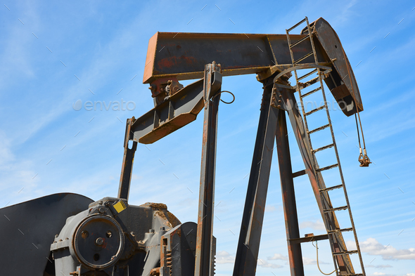 Oil pumping machine. Pump jack. Petroleum extraction. Global warming ...