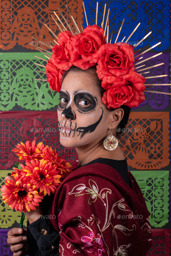 Catrina holding a bouquet of flowers Stock Photo by auroraangeles ...