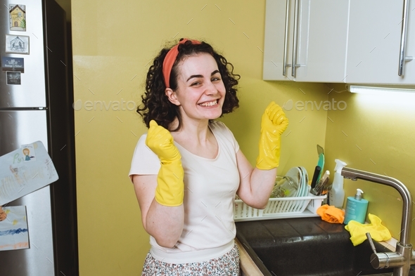 Happy woman hands up after washing dishes in kitchen Stock Photo by ...
