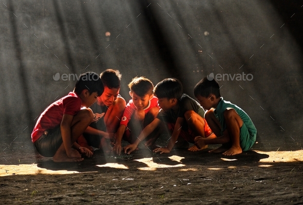 Children playing marbles Stock Photo by ekobudiutomo | PhotoDune