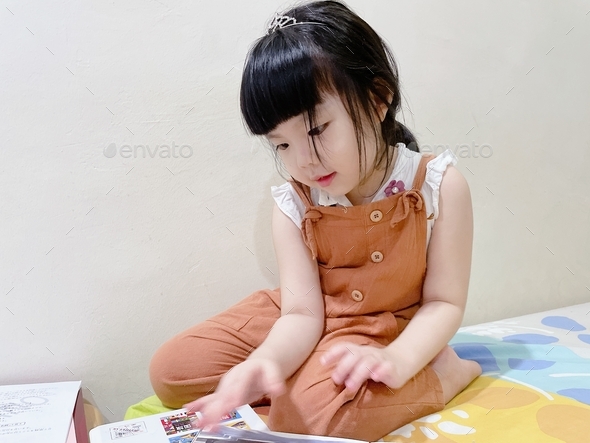 Little girl reading story book Stock Photo by louisong | PhotoDune