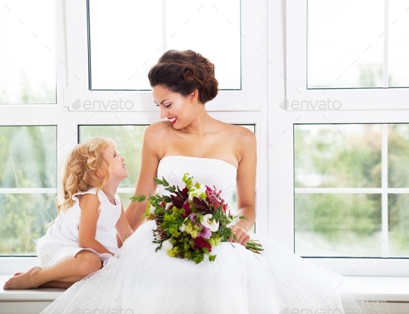 Smiling happy bride and a flower indoors. Horizontal shot Stock Photo ...