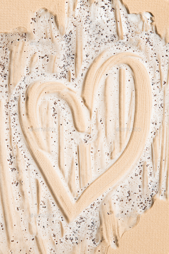 Heart shape on smeared cosmetic product top view. Beauty treatments ...
