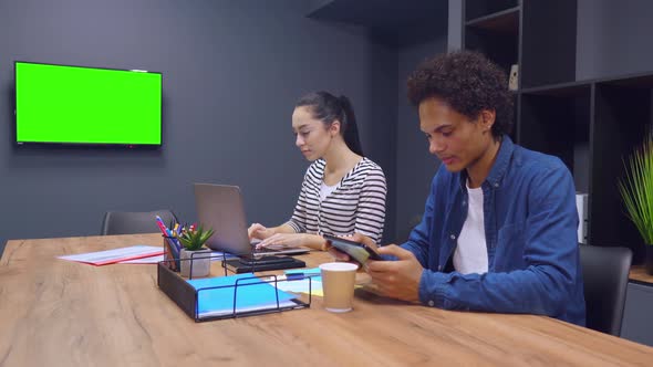 Two Workmates Teaming Up and Working Together, Stock Footage | VideoHive