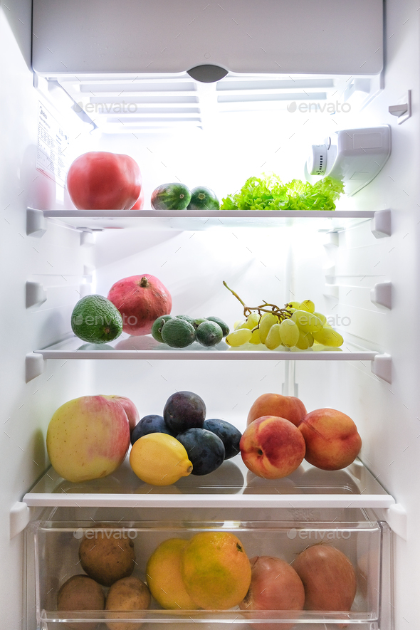 open fridge with fresh fruits and vegetables. refrigerator with healthy ...