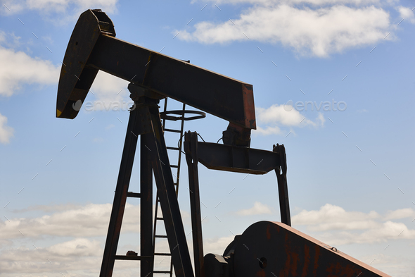 Oil pumping machine. Pump jack. Petroleum extraction. Global warming ...