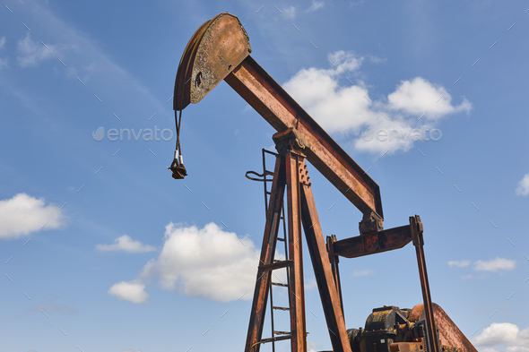 Oil pumping machine. Pump jack. Petroleum extraction. Global warming ...