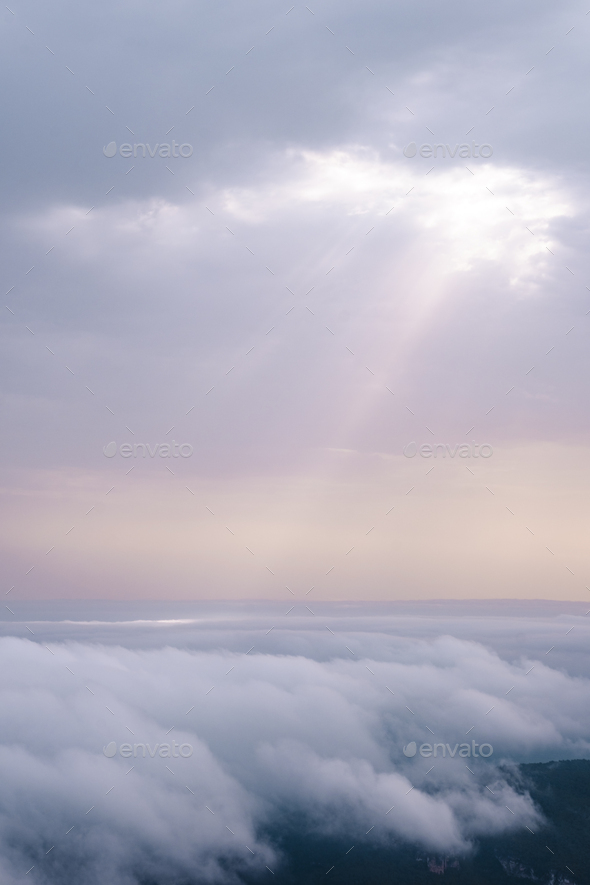 Sunbeams breaking through the clouds and impacting on top of other ...