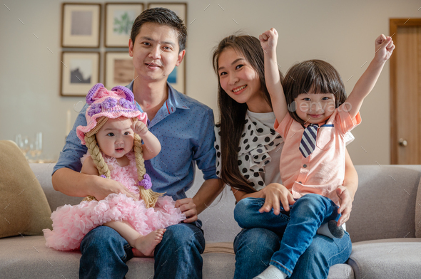 Portrait of parents happy full family have fun sitting on sofa in ...