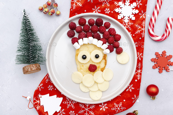 Christmas Santa Claus face shaped pancake with raspberry berry and ...